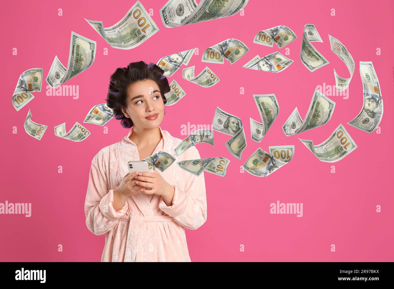 Online payment. Woman buying something using mobile phone on pink ...