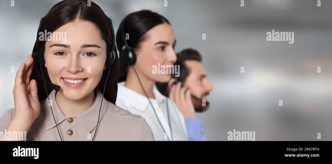 Hotline operators with headsets in office, space for text. Banner ...