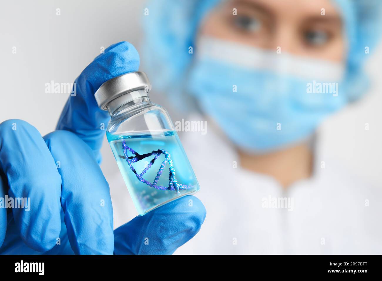 Genetics research. Scientist holding vial with liquid and illustration ...