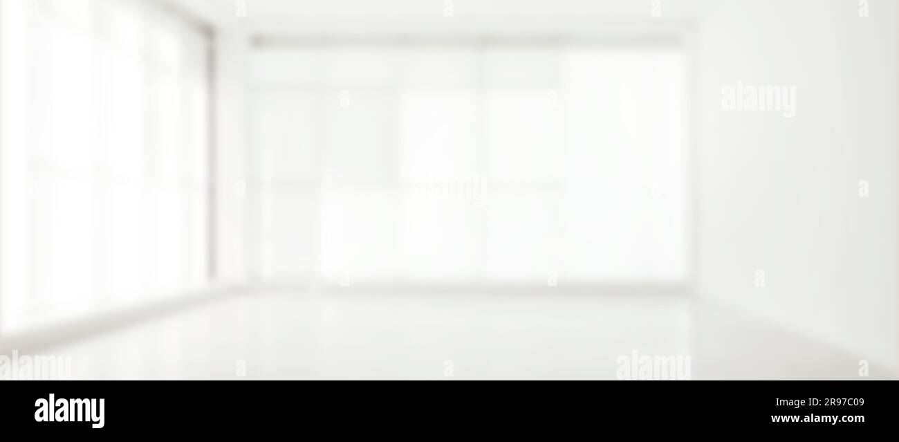 Empty room with white wall and panoramic windows, blurred view. Banner ...