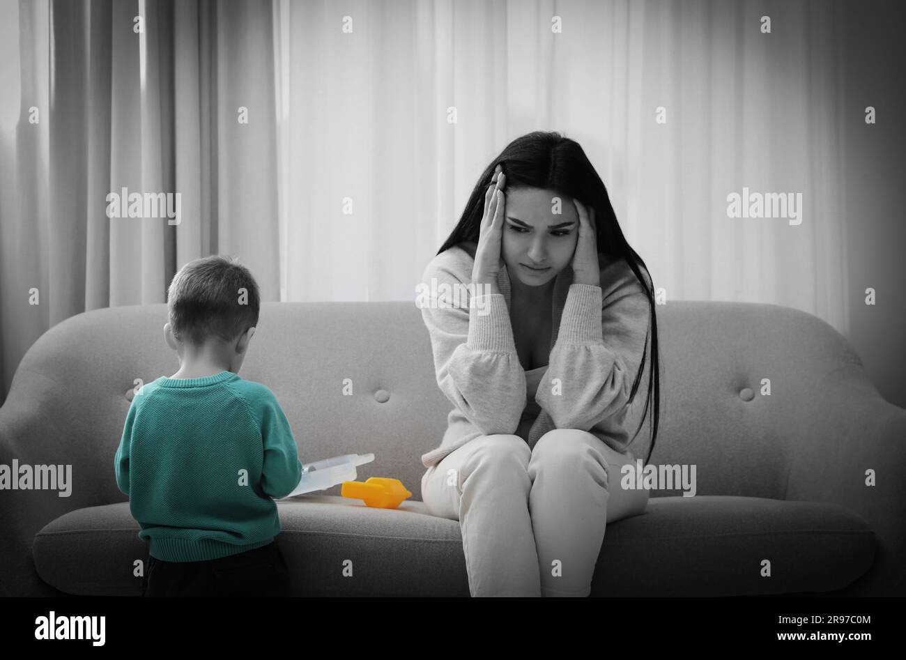 Depressed single mother with child at home, color toned Stock Photo - Alamy