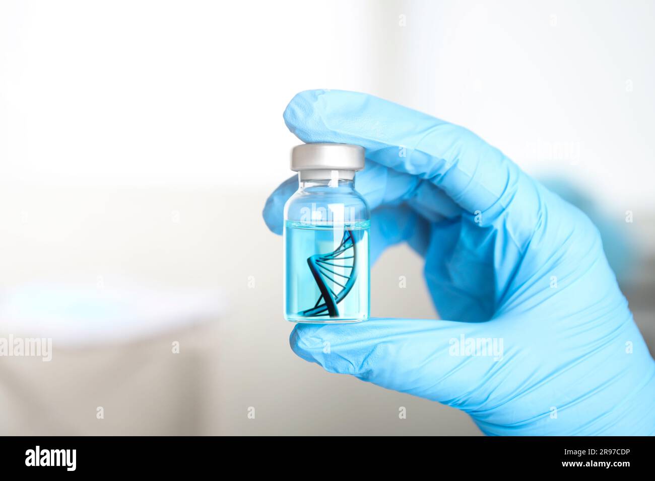 Genetics research. Scientist holding vial with liquid and illustration ...