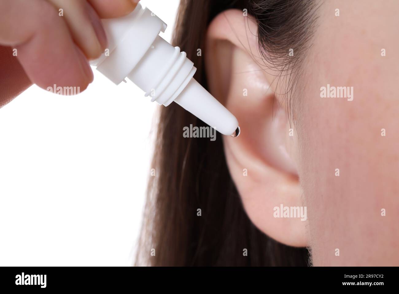Woman using ear drops on white background, closeup Stock Photo - Alamy