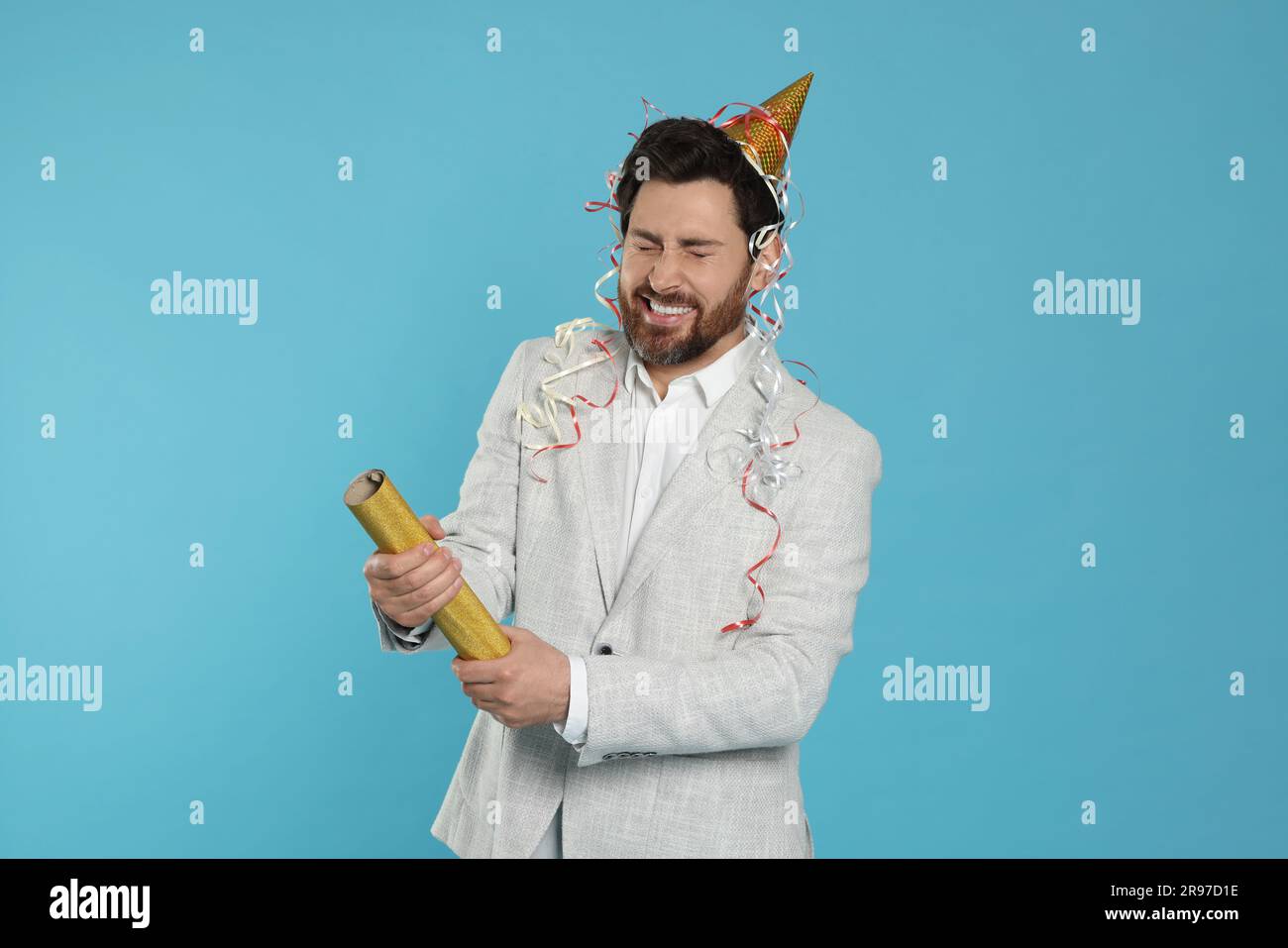 Handsome man party popper hi-res stock photography and images - Alamy