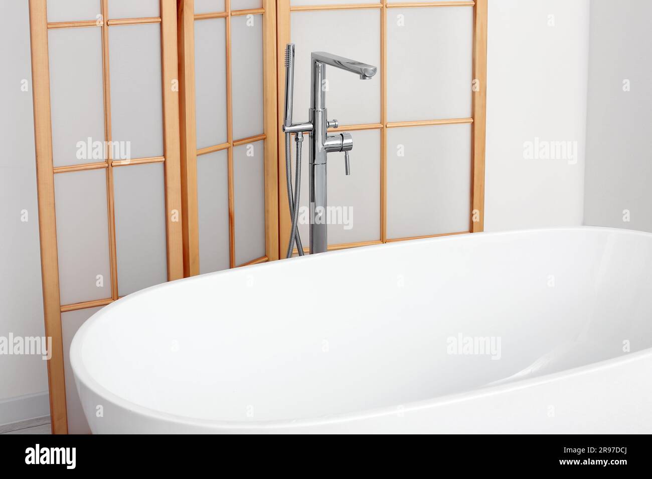 White ceramic tub in bathroom. Interior design Stock Photo - Alamy