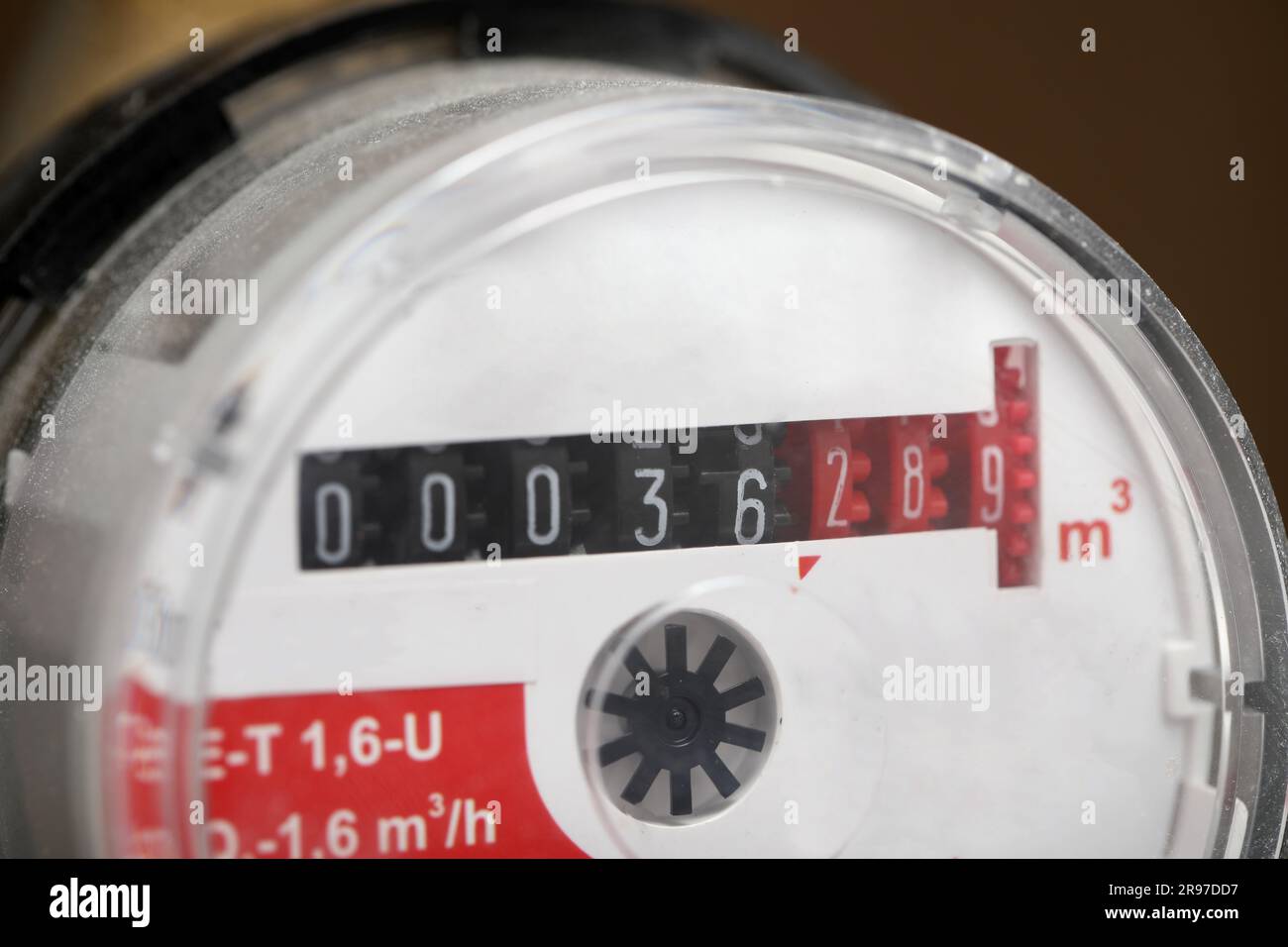 Electric meter on blurred background, closeup view. Water measuring ...