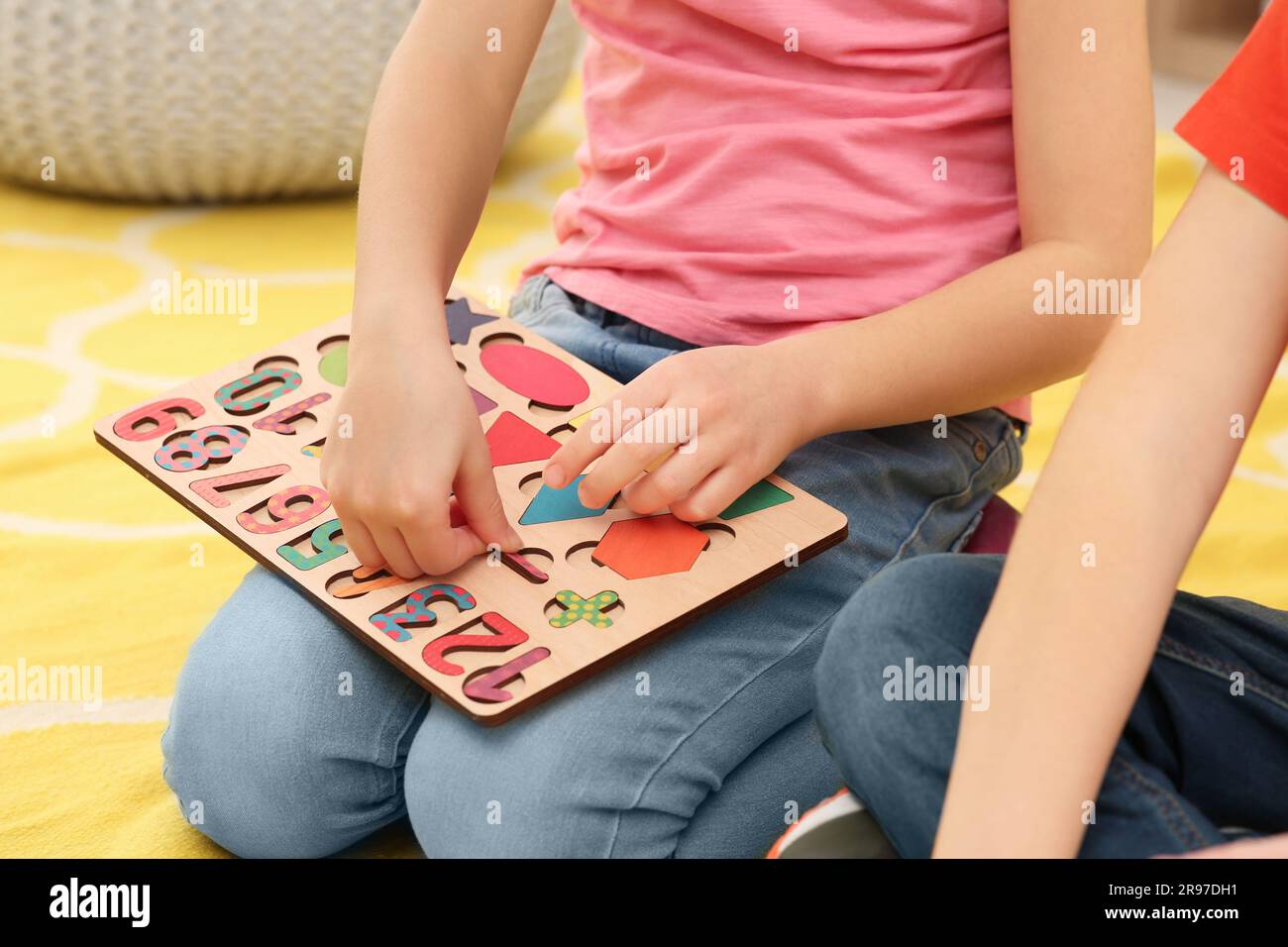 Children playing with math game kit on floor, closeup. Learning ...