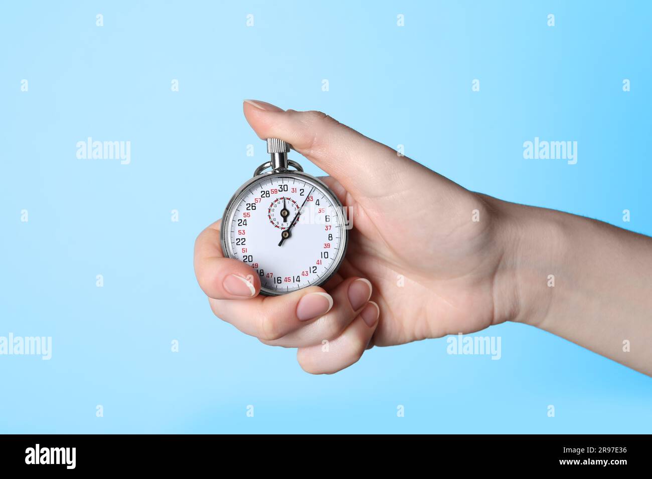 Hand holding mechanical stopwatch hi-res stock photography and images ...