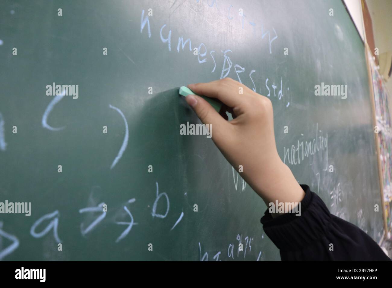 Mathematical equations on board school hi-res stock photography and ...