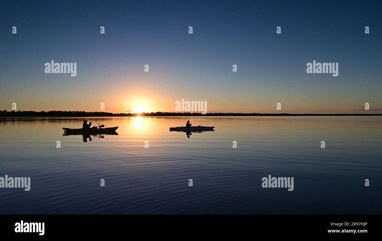 Two kayakers on calm water of Coot Bay in Everglades National Park ...