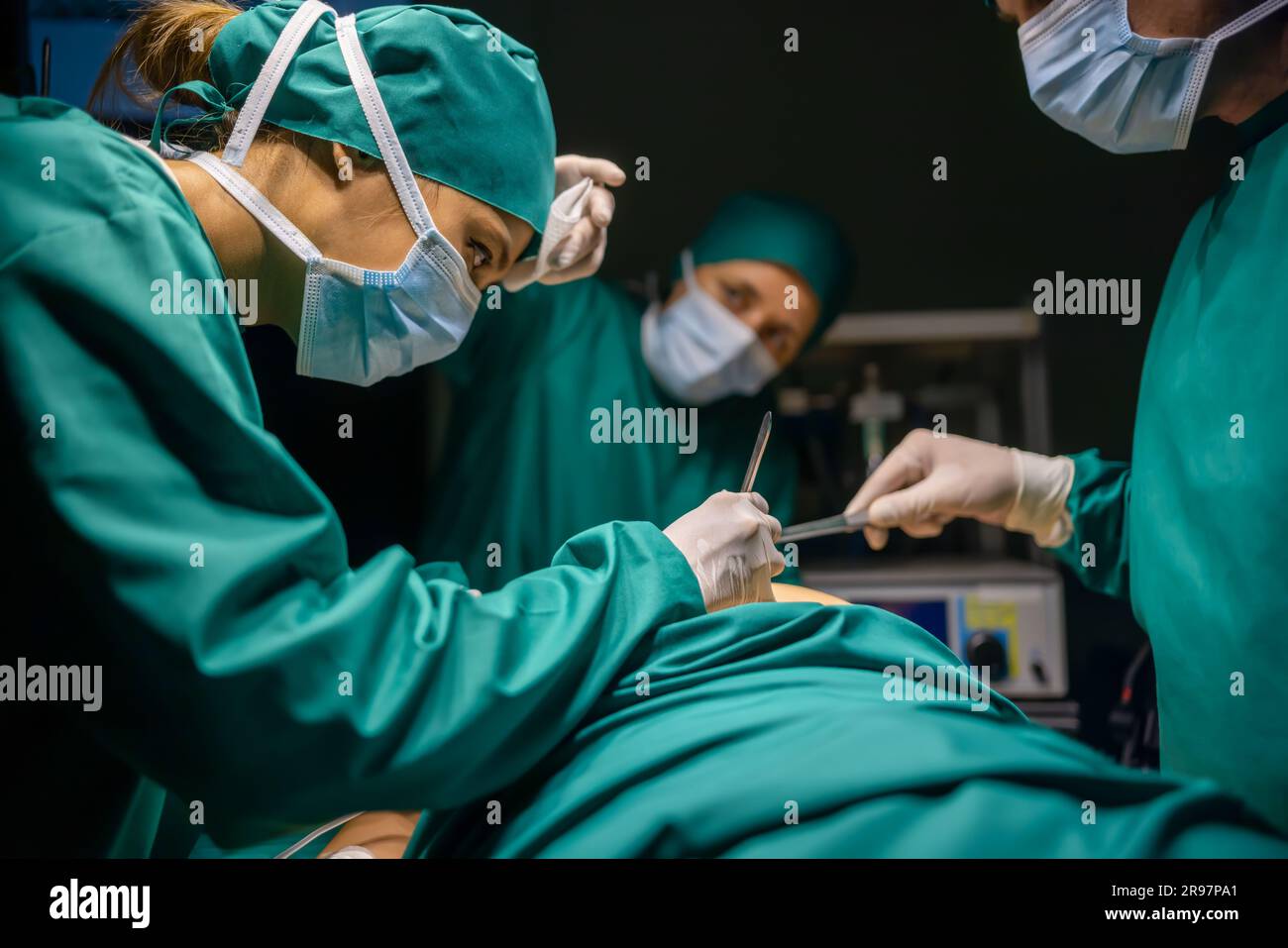 Asian medical team performing surgery in operation room Stock Photo - Alamy
