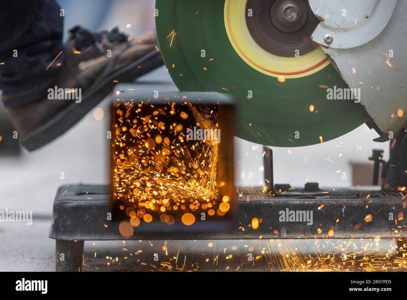 Worker cutting steel square pipe in constuction site Stock Photo - Alamy