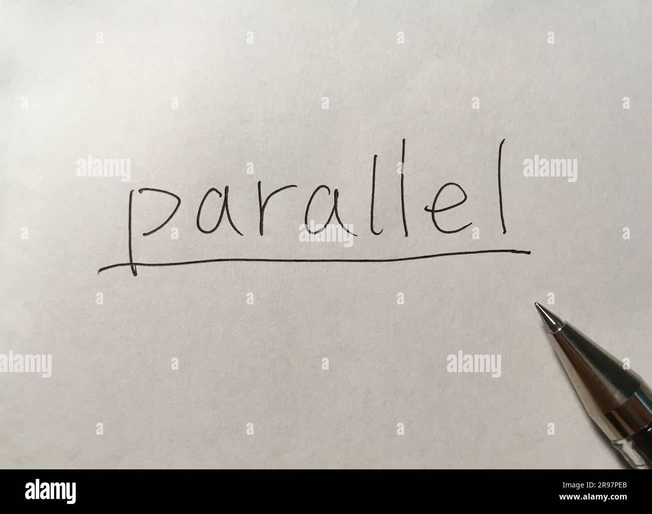 Parallel concept word on paper background Stock Photo - Alamy