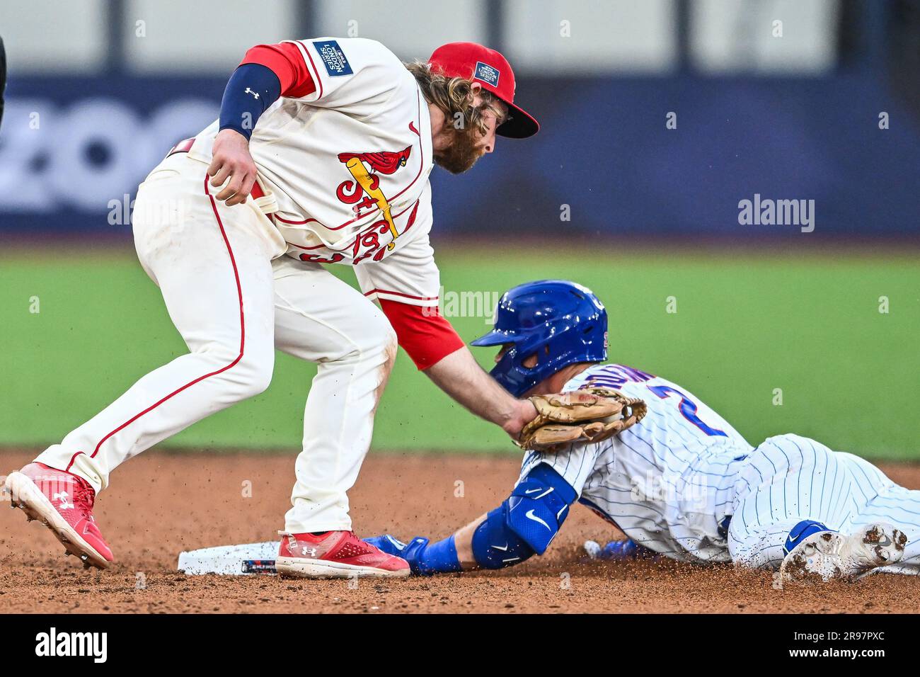 Brendan Donovan #33 of the St. Louis Cardinals tags Nico Hoerner #2 of ...