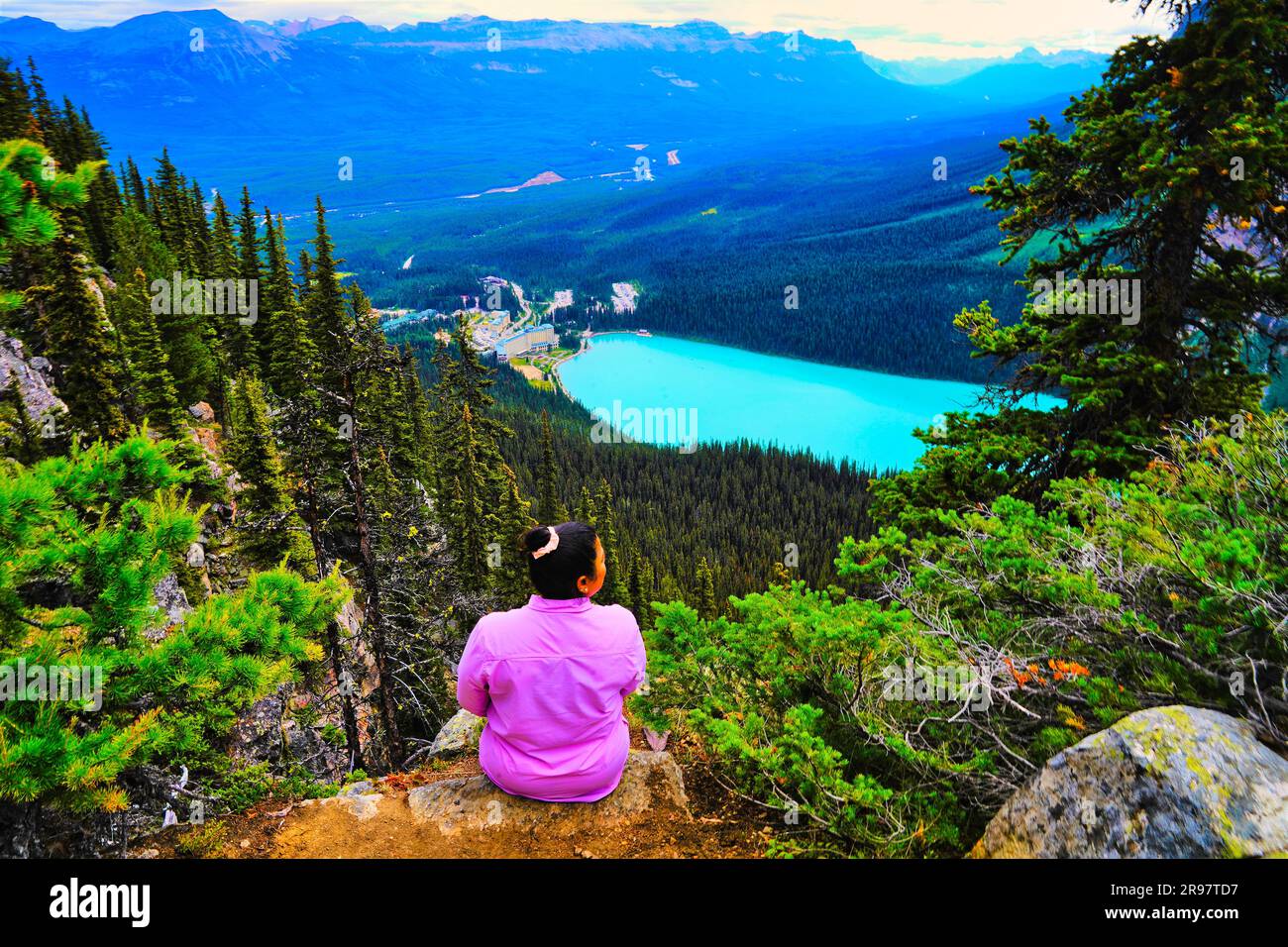 Banff, Canada, August 28th 2022 - A Tourist poses for a photo on the ...