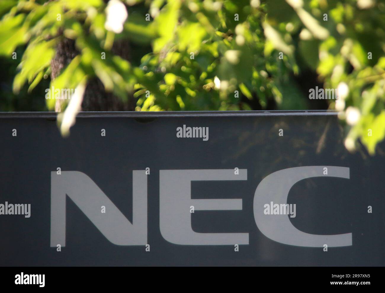 The logo of NEC Corporation is seen in Minato Ward, Tokyo on June 20, 2023. NEC Corporation is a ...