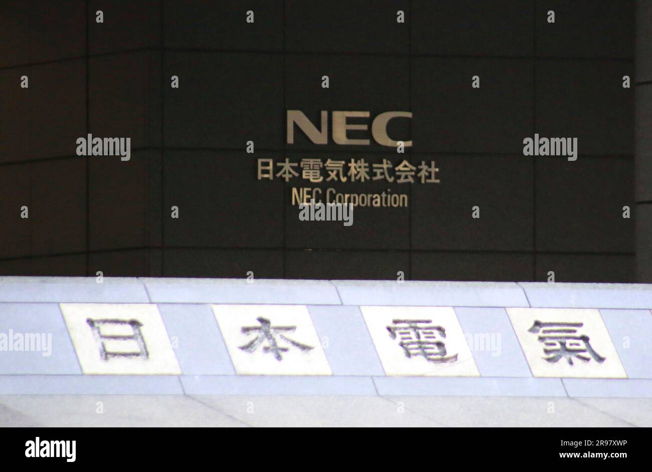 The logo of NEC Corporation is seen in Minato Ward, Tokyo on June 20, 2023. NEC Corporation is a ...