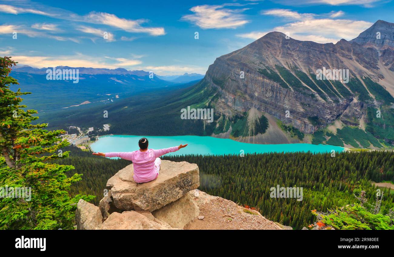 Banff, Canada, August 28th 2022 - A Tourist poses for a photo on the ...