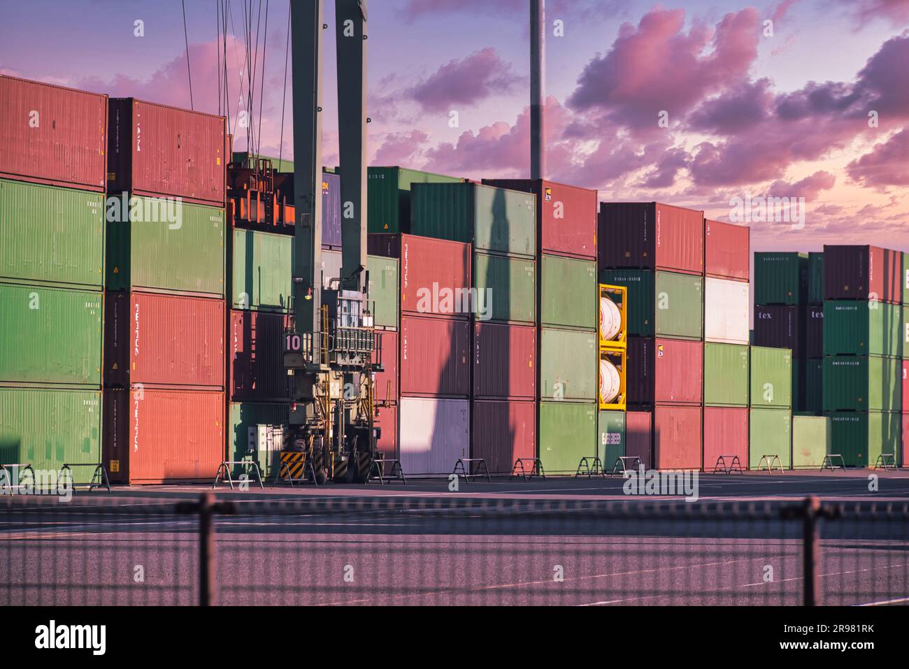 A dusk of Containers and cranes near the port in Aomi Tokyo telephoto ...