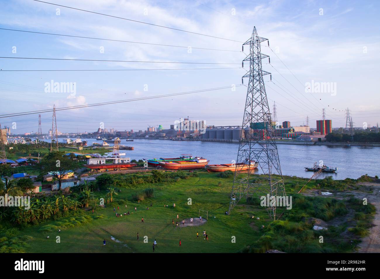 Aerial view of High voltage power line on the river and blue sky ...