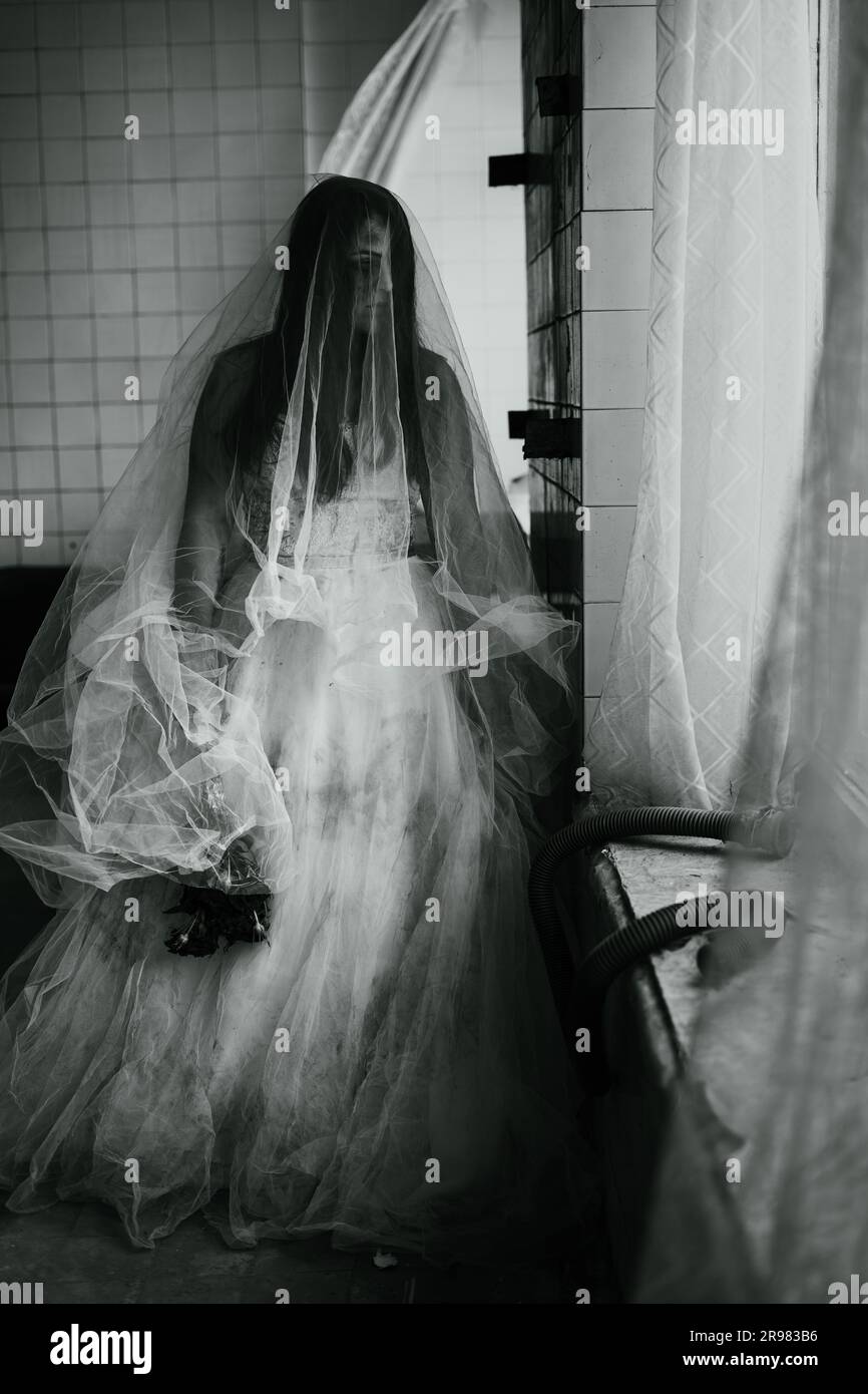 Scary scene with ghost, zombie bride with a bouquet in an abandoned ...