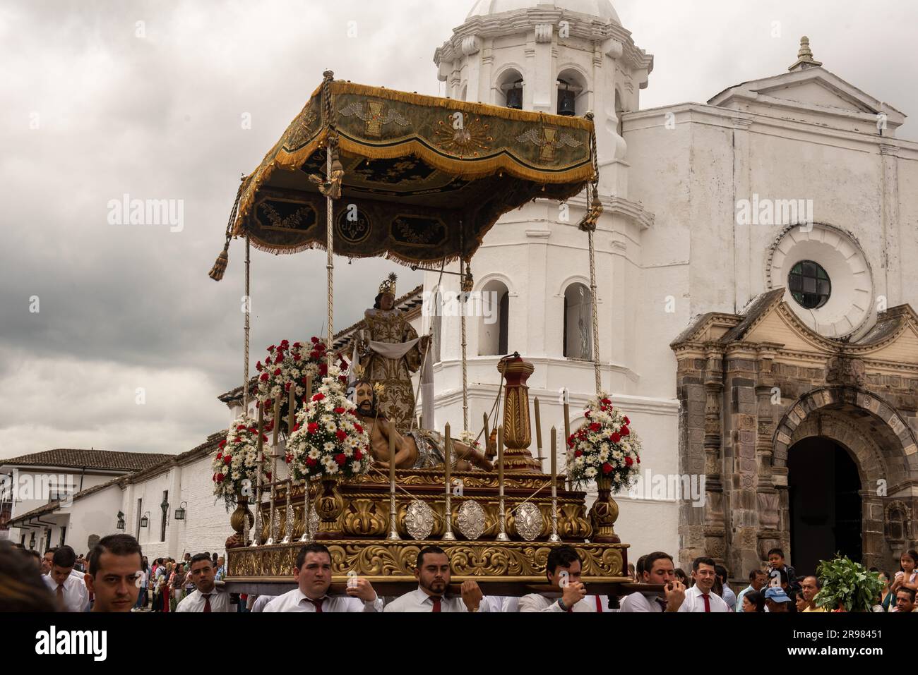 A festive procession of religious worshipers in the Colombian city of ...