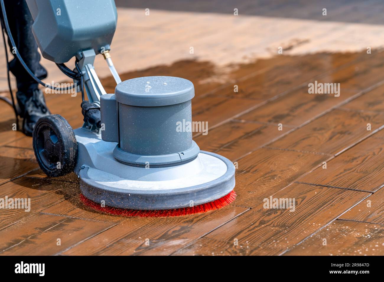 manual cleaning of concrete and stone terraces of the house with a ...
