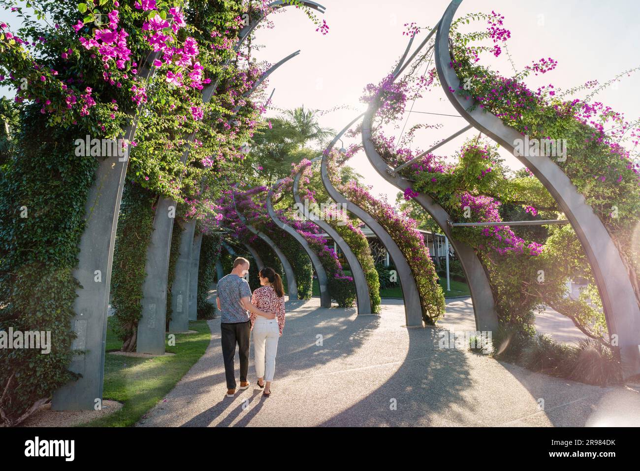 Couple walk through the Arbour in Brisbane Stock Photo - Alamy