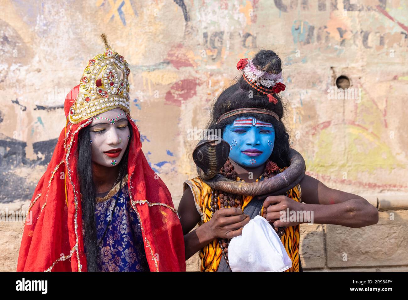 Portrait of a young boy dress up like lord shiva and goddess parvati ...