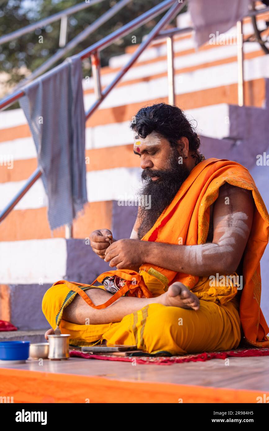Portrait of Unidentified Indian holy sadhu male sittings at kedar ghat ...