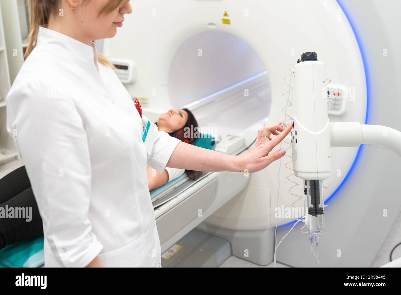 Female patient undergoing MRI - Magnetic resonance imaging in Hospital ...