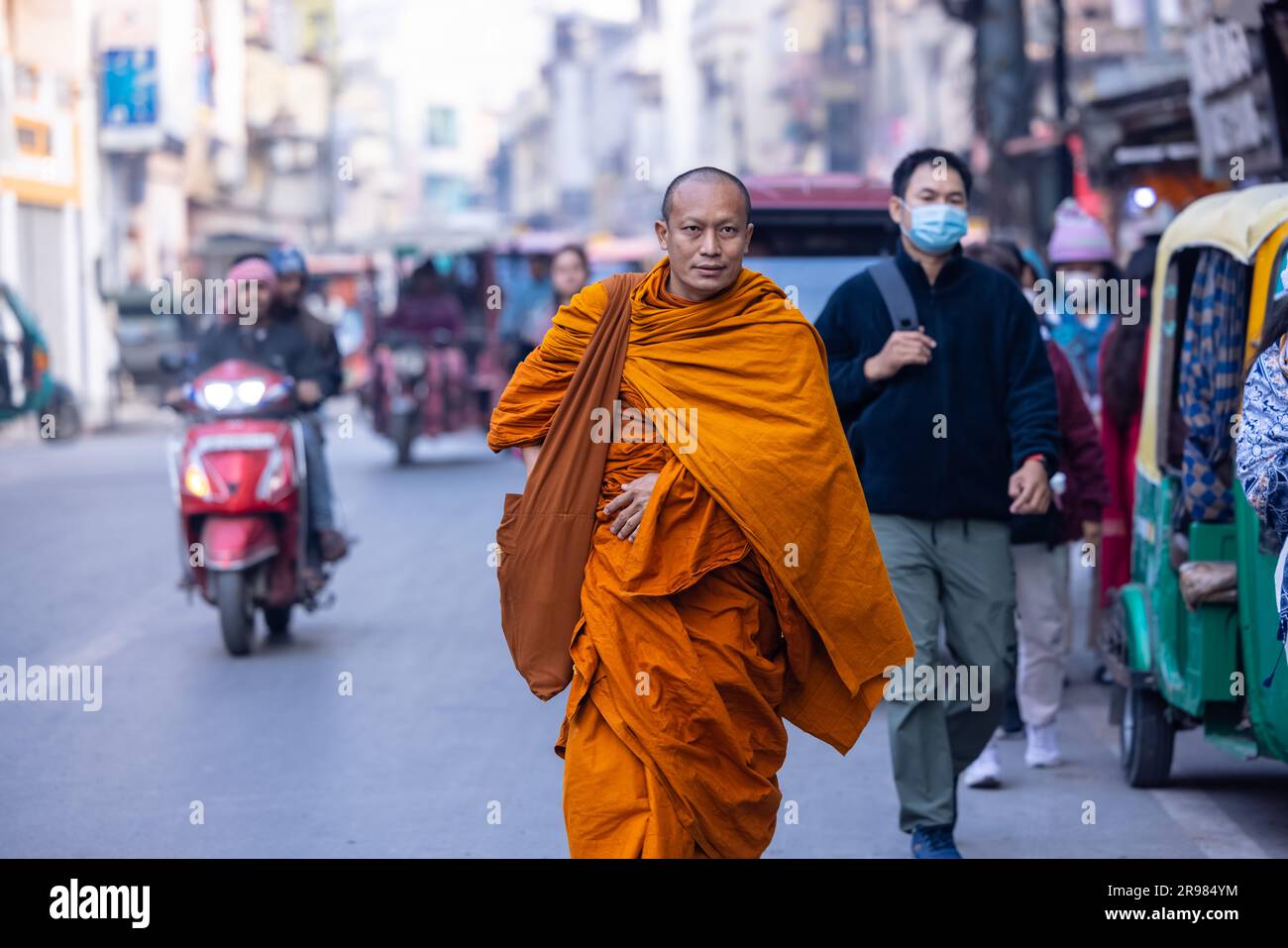 Portrait of Unidentified Indian buddhist monk walking on streets near ...