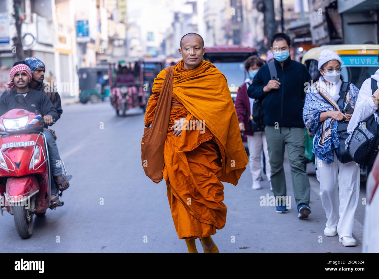 Portrait of Unidentified Indian buddhist monk walking on streets near ...