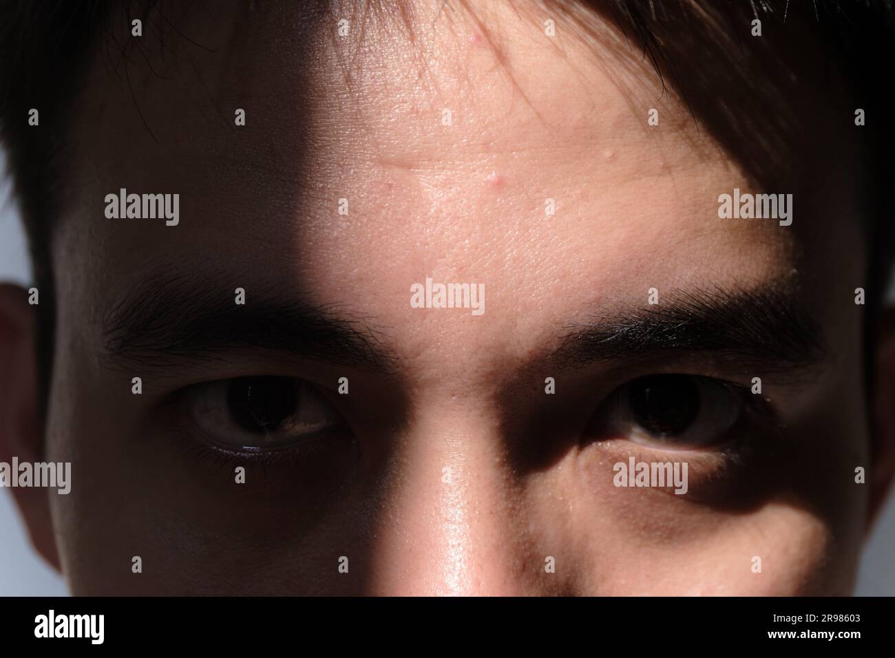 Man face looking up close up shadow hi-res stock photography and images ...