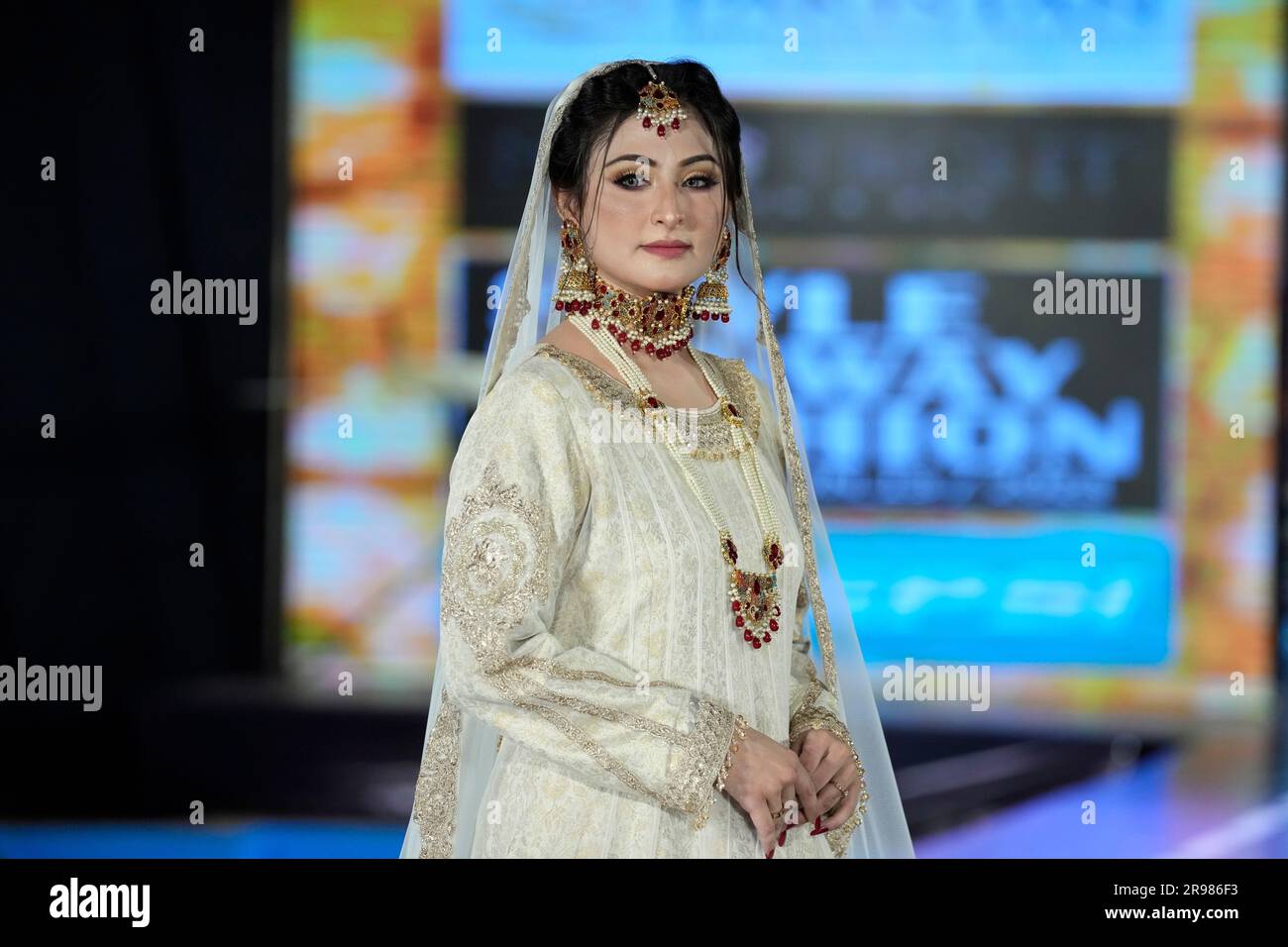 A model presents creations by Pakistani designer My Apparels during a Fashion Show in Karachi ...