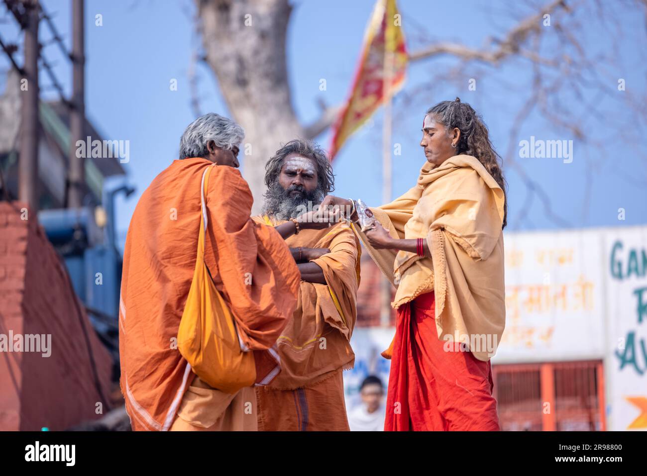 Portrait of Unidentified Indian holy sadhu male and female walking at ...