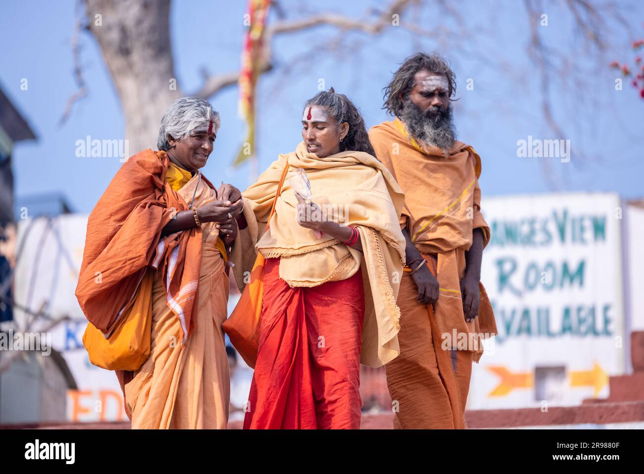 Portrait of Unidentified Indian holy sadhu male and female walking at ...