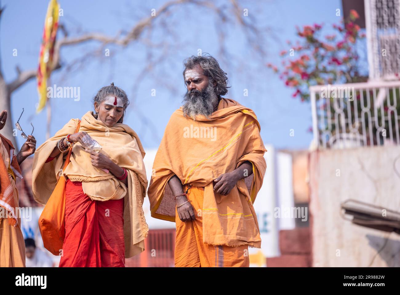 Portrait of Unidentified Indian holy sadhu male and female walking at ...