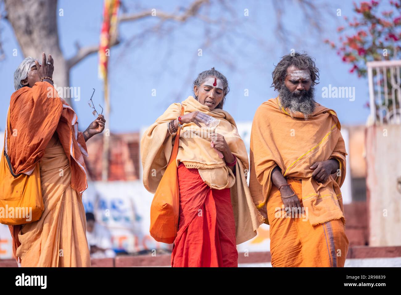 Portrait of Unidentified Indian holy sadhu male and female walking at ...