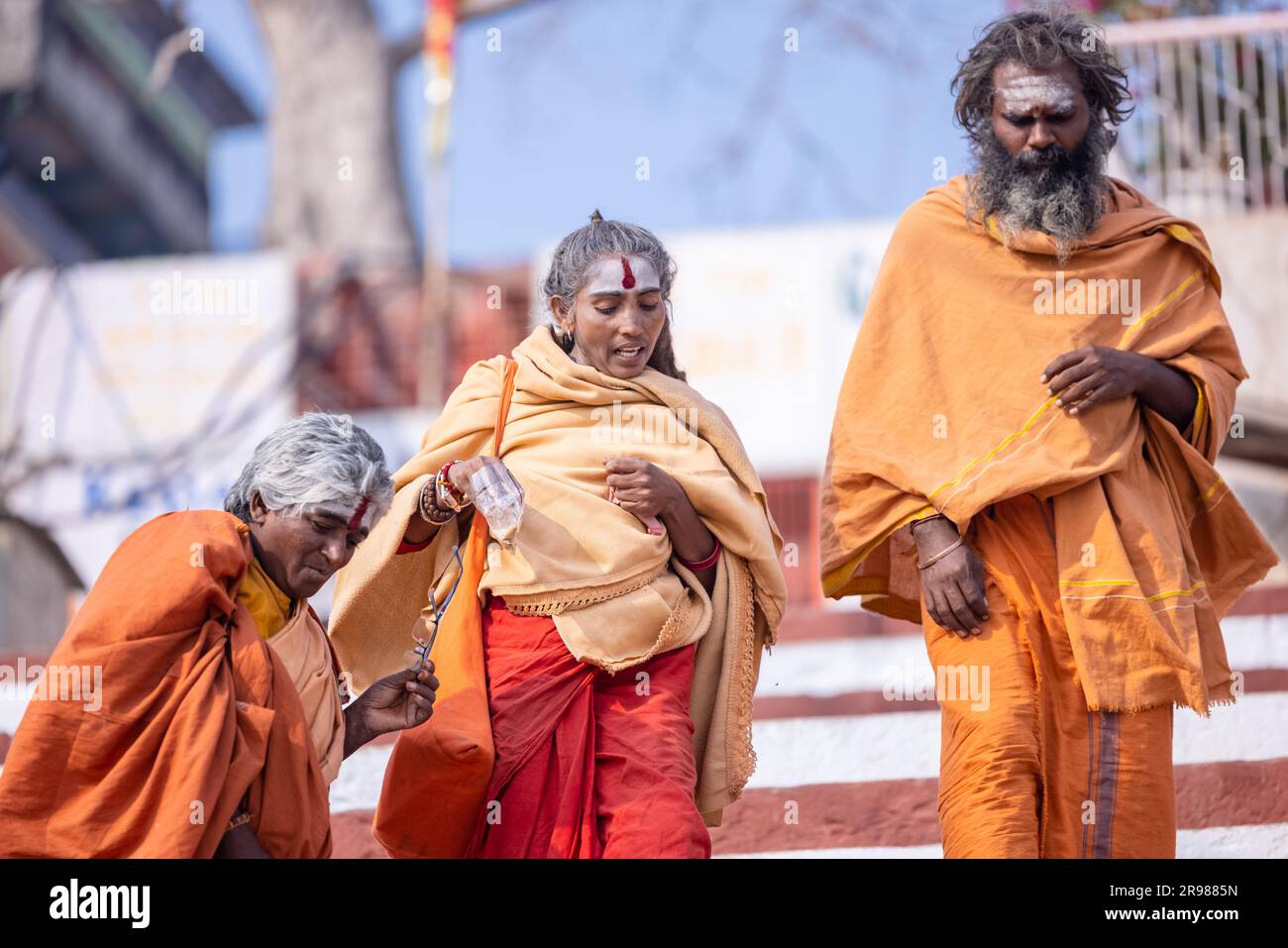 Portrait of Unidentified Indian holy sadhu male and female walking at ...
