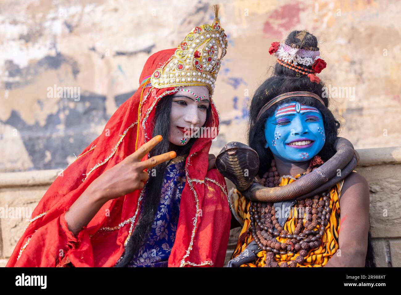 Portrait of a young boy dress up like lord shiva and goddess parvati ...