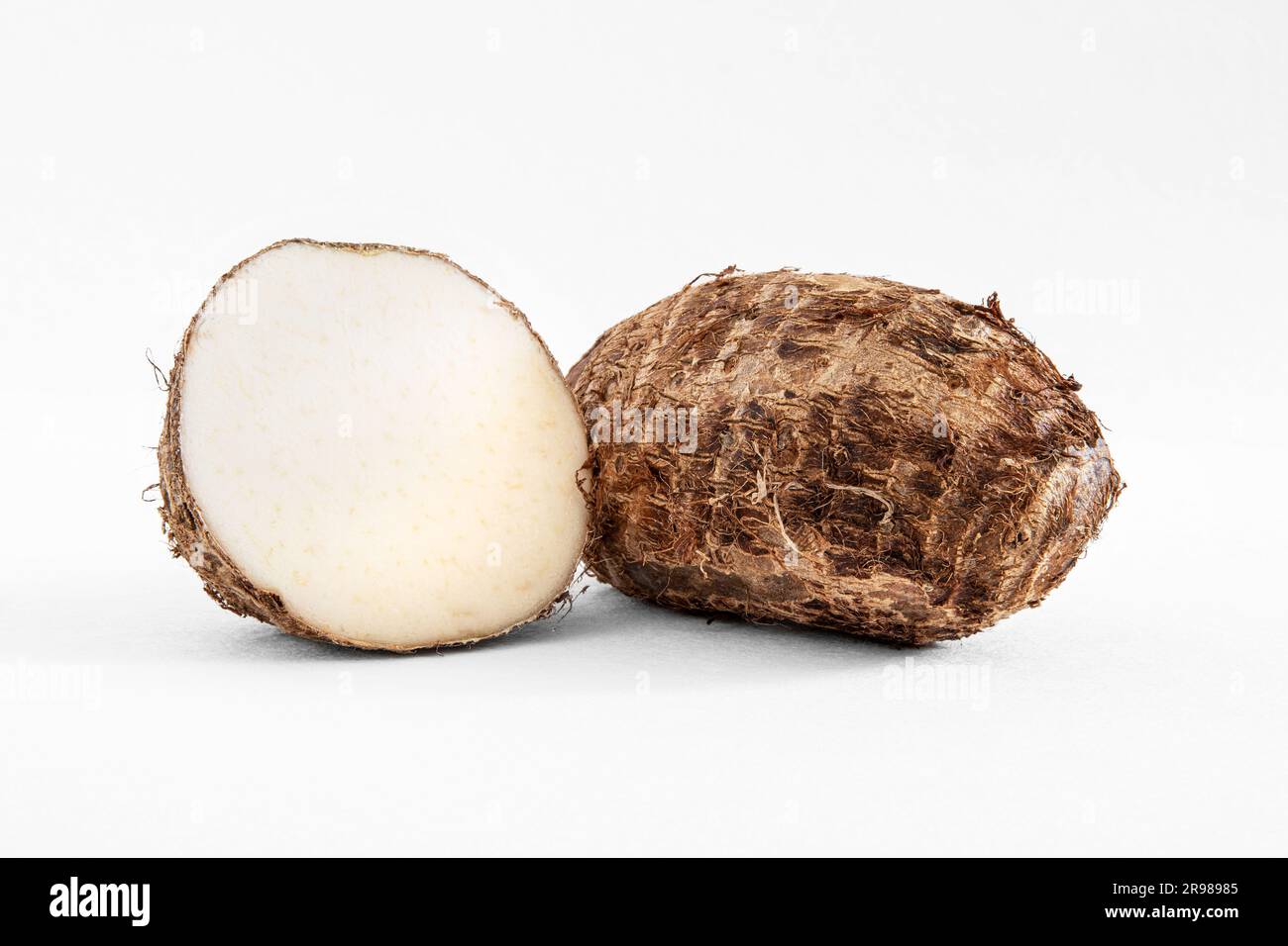 raw whole and cut taro or eddo tuber root Stock Photo - Alamy