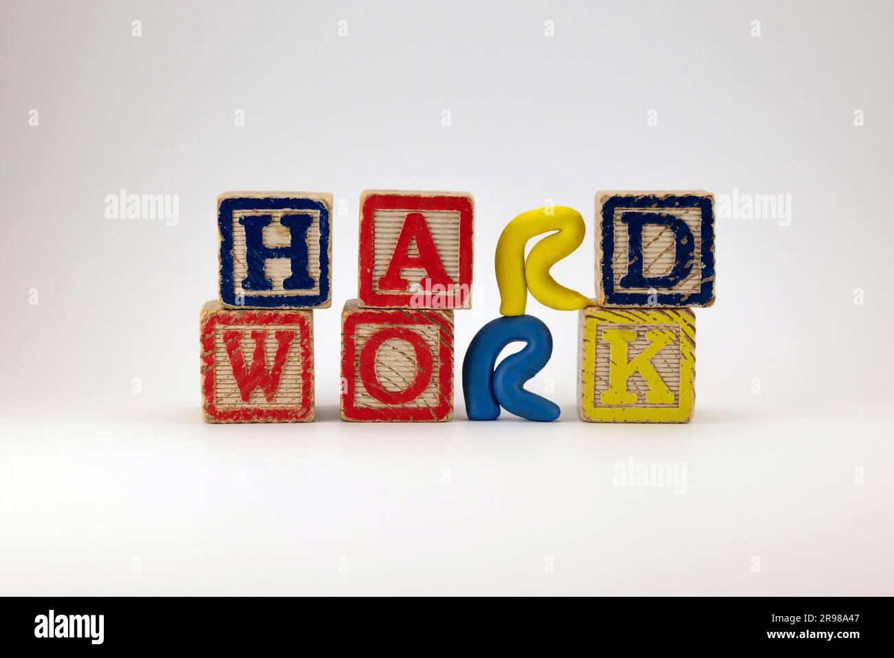 Concept image of hard and hard work on white background Stock Photo - Alamy
