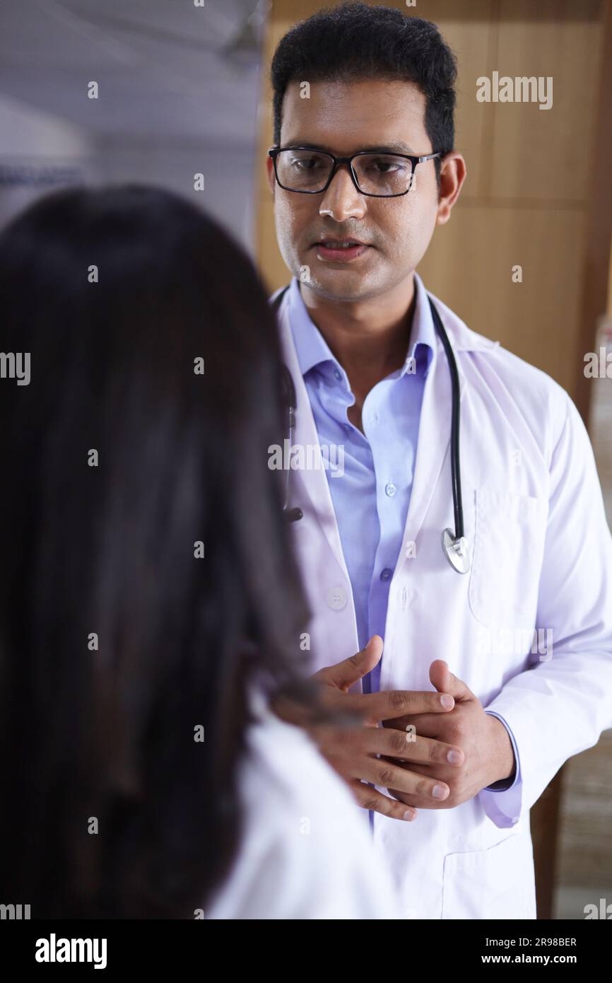 Doctor talking with a patient in a hospital hi-res stock photography ...
