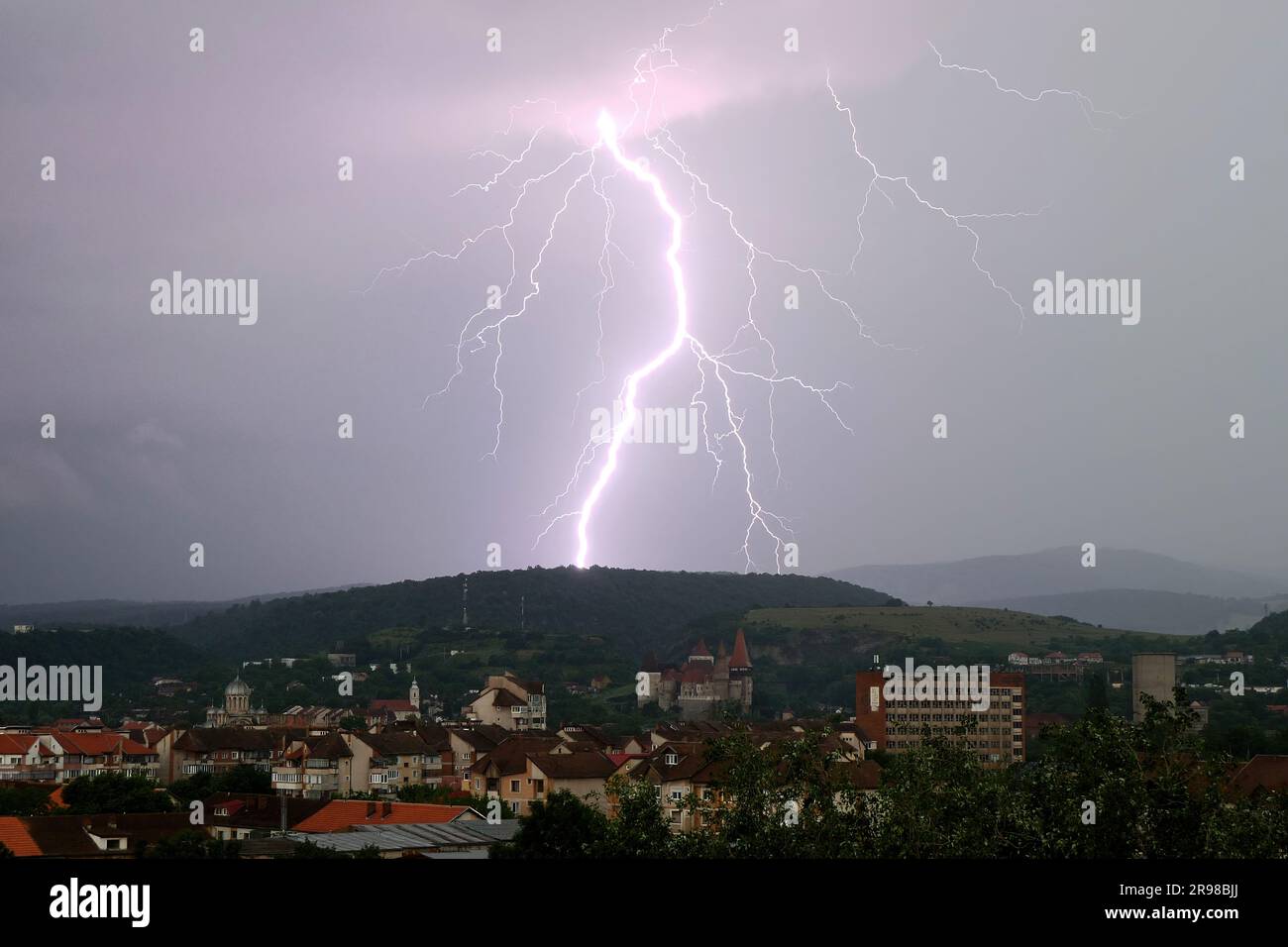 Storm Clouds and Lightning Bolts above the City Hunedoara, Romania ...