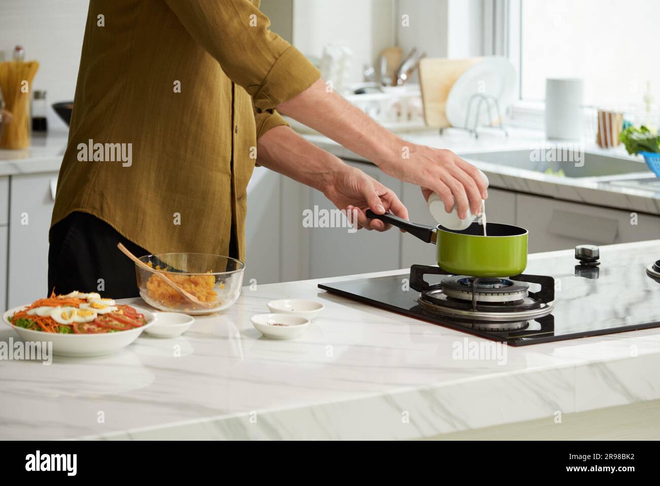Adding cream soup stirring hi-res stock photography and images - Alamy