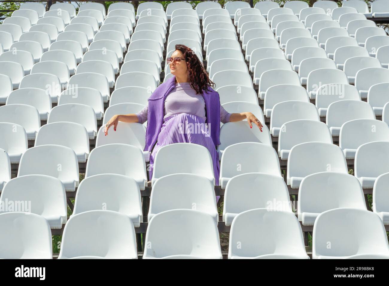 Woman Seats of tribune on sport stadium. Concept of fans, chairs for ...