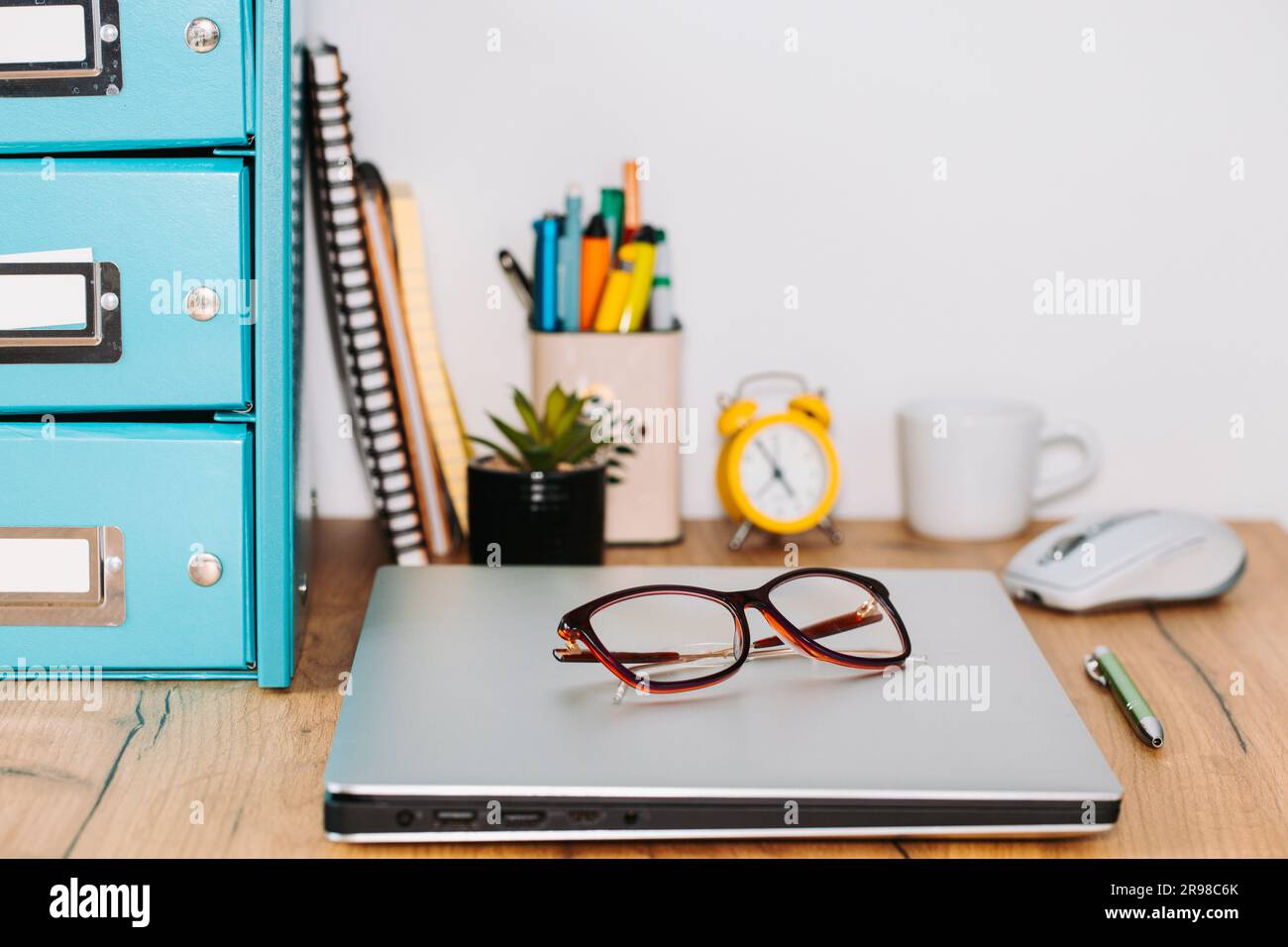 the closed notebook computer was placed on the desk in the office ...
