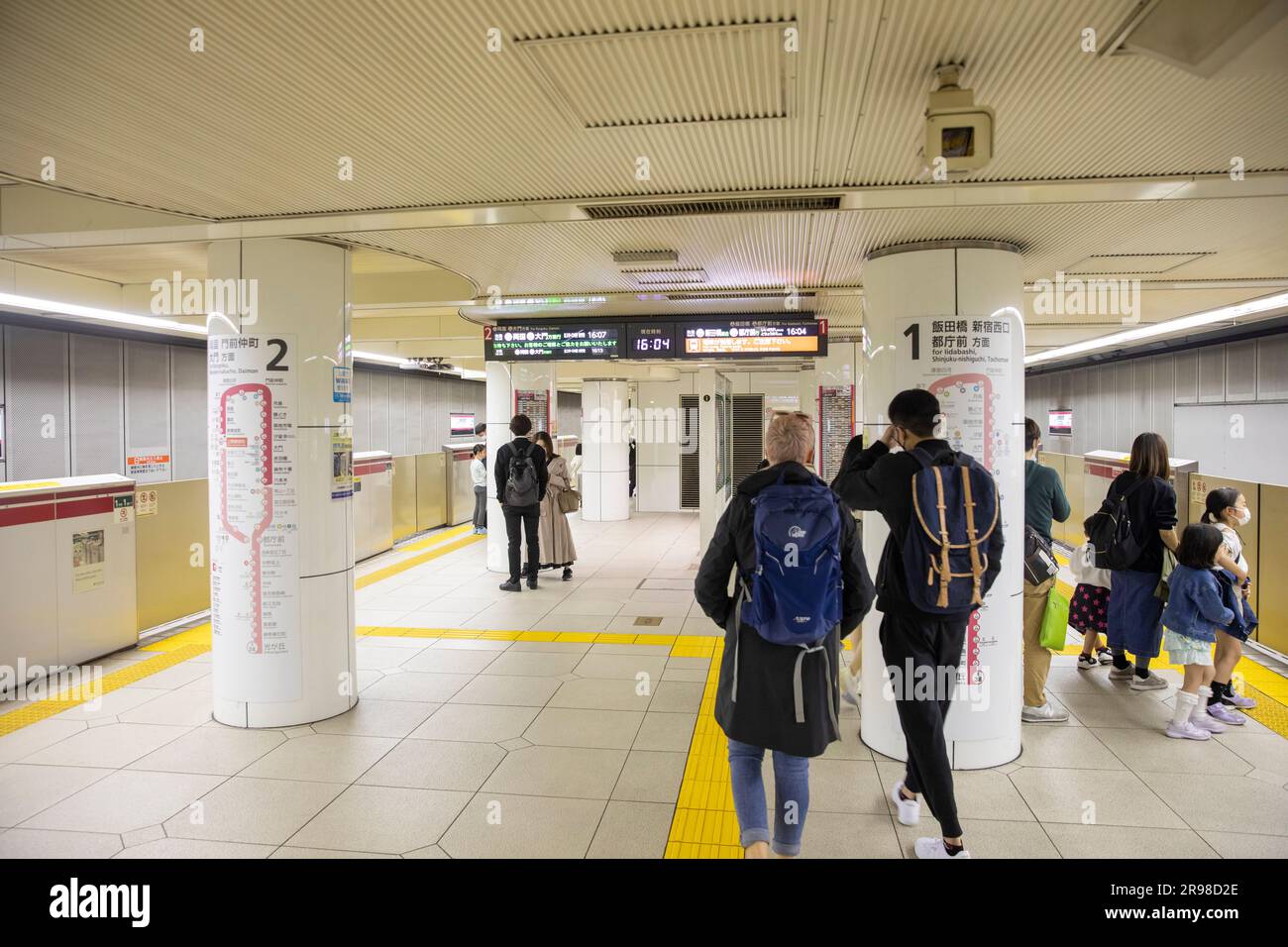 Tokyo rail metro network commuters in metro station on platform ...