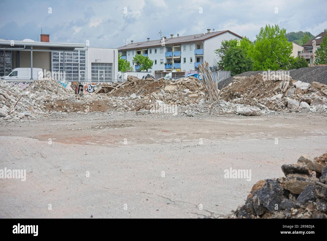 demolition of a building with excavators and construction machinery ...
